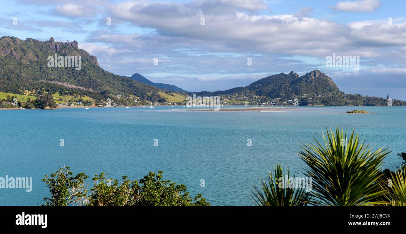 Distant view from across the bay to the rural settlement Parua Bay, Te ...