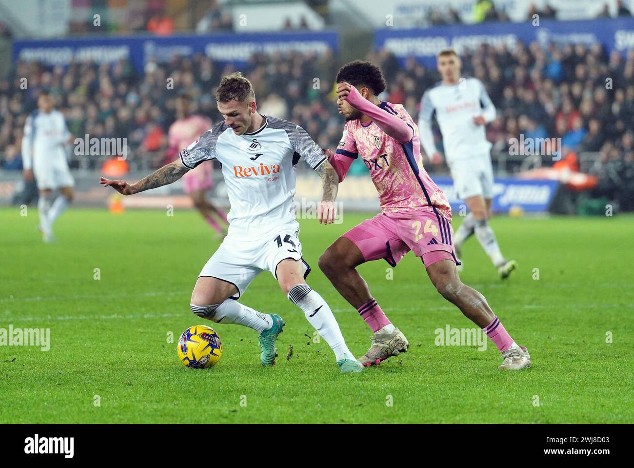Swansea City's Josh Tymon and Leeds United's Georginio Rutter (right ...