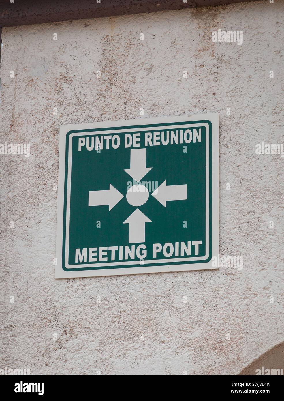 Meeting point sign on a potential hurricane shelter Stock Photo - Alamy