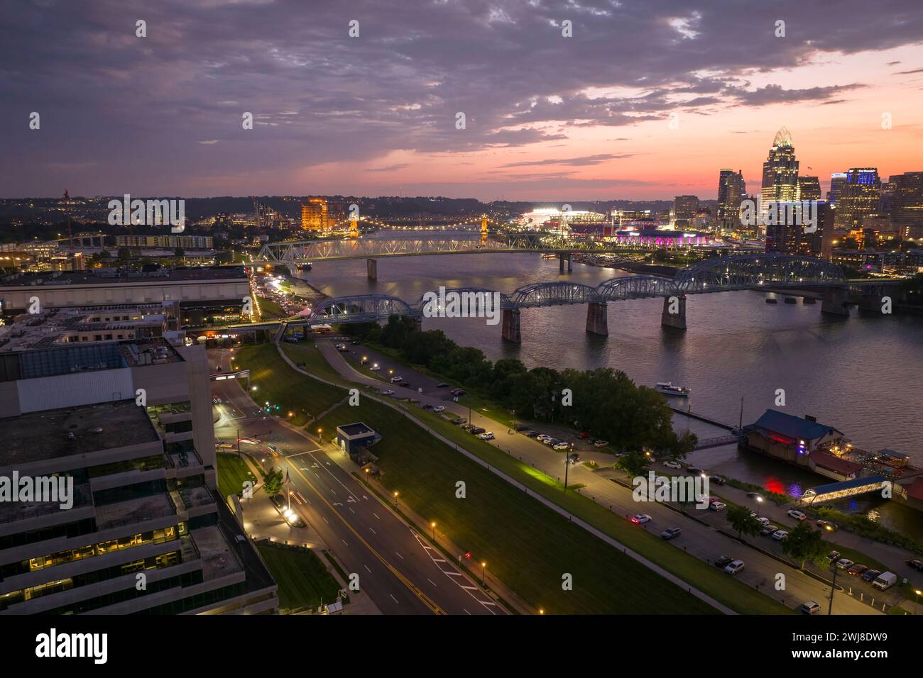 Downtown district of Cincinnati city in Ohio, USA at night with driving ...