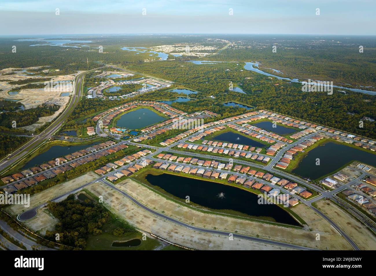 Aerial view of real estate development with tightly located family ...