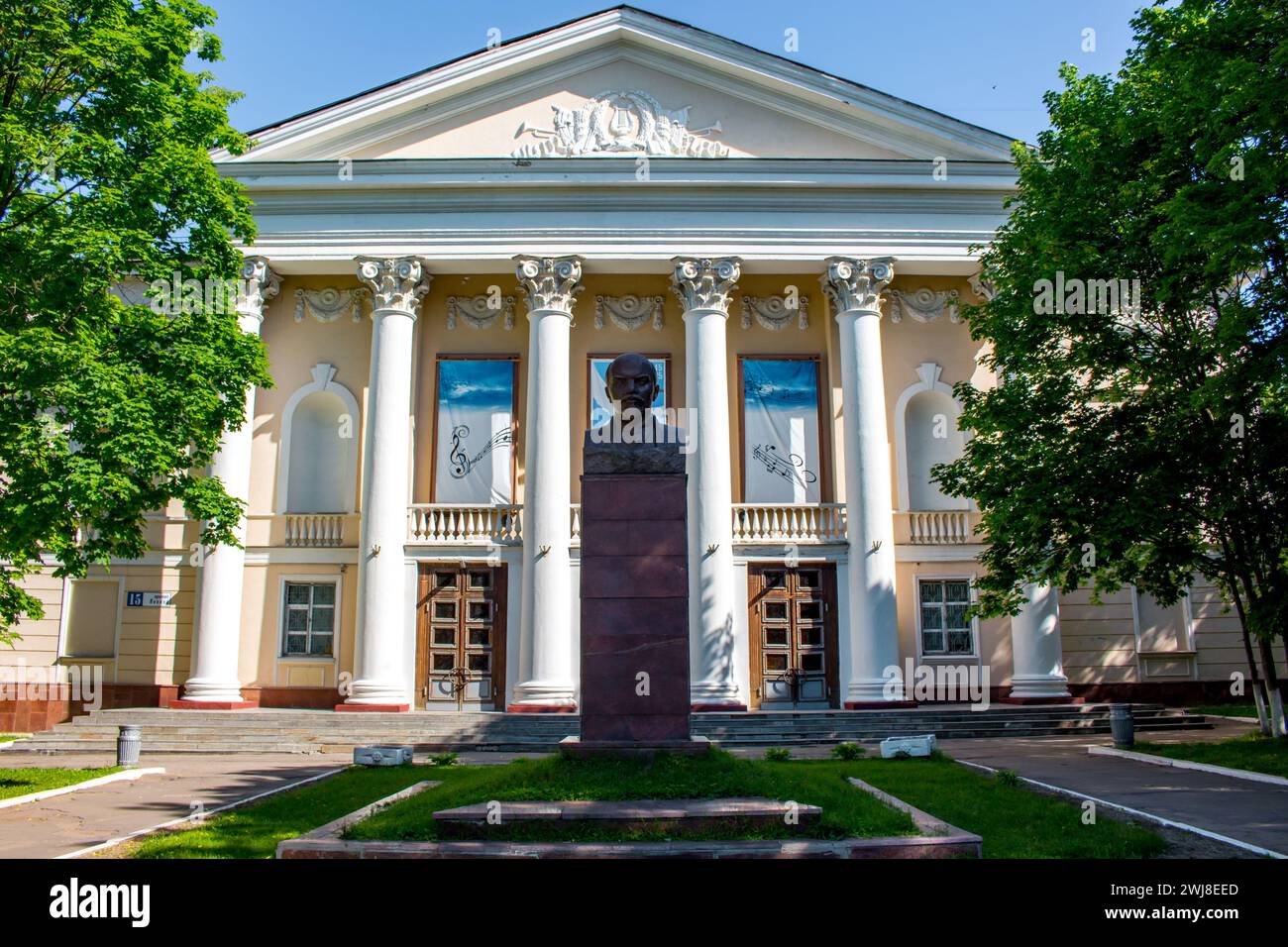 Obninsk, Russia - June 2015: The House of Culture and the monument-bust ...