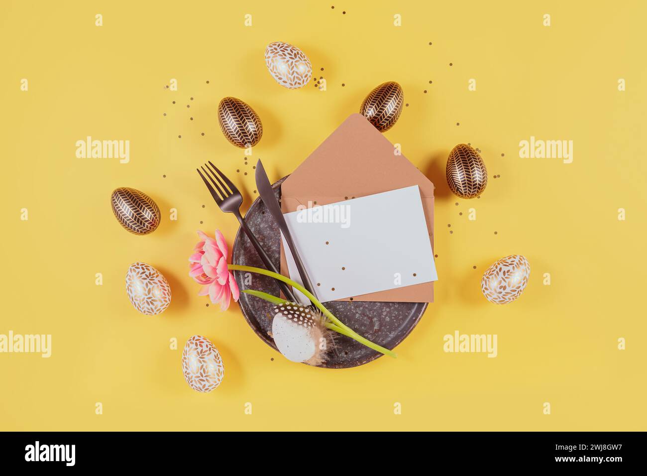Table place setting with empty greeting or invitation card and Easter ...