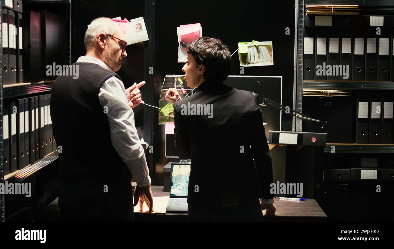 Law officers analyzing clues board to connect the dots and solve crime ...