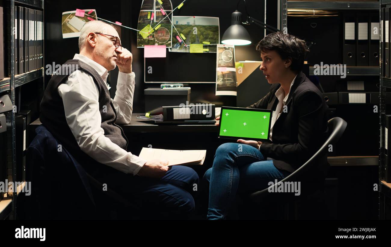 Police officers using greenscreen analyze hi-res stock photography and ...