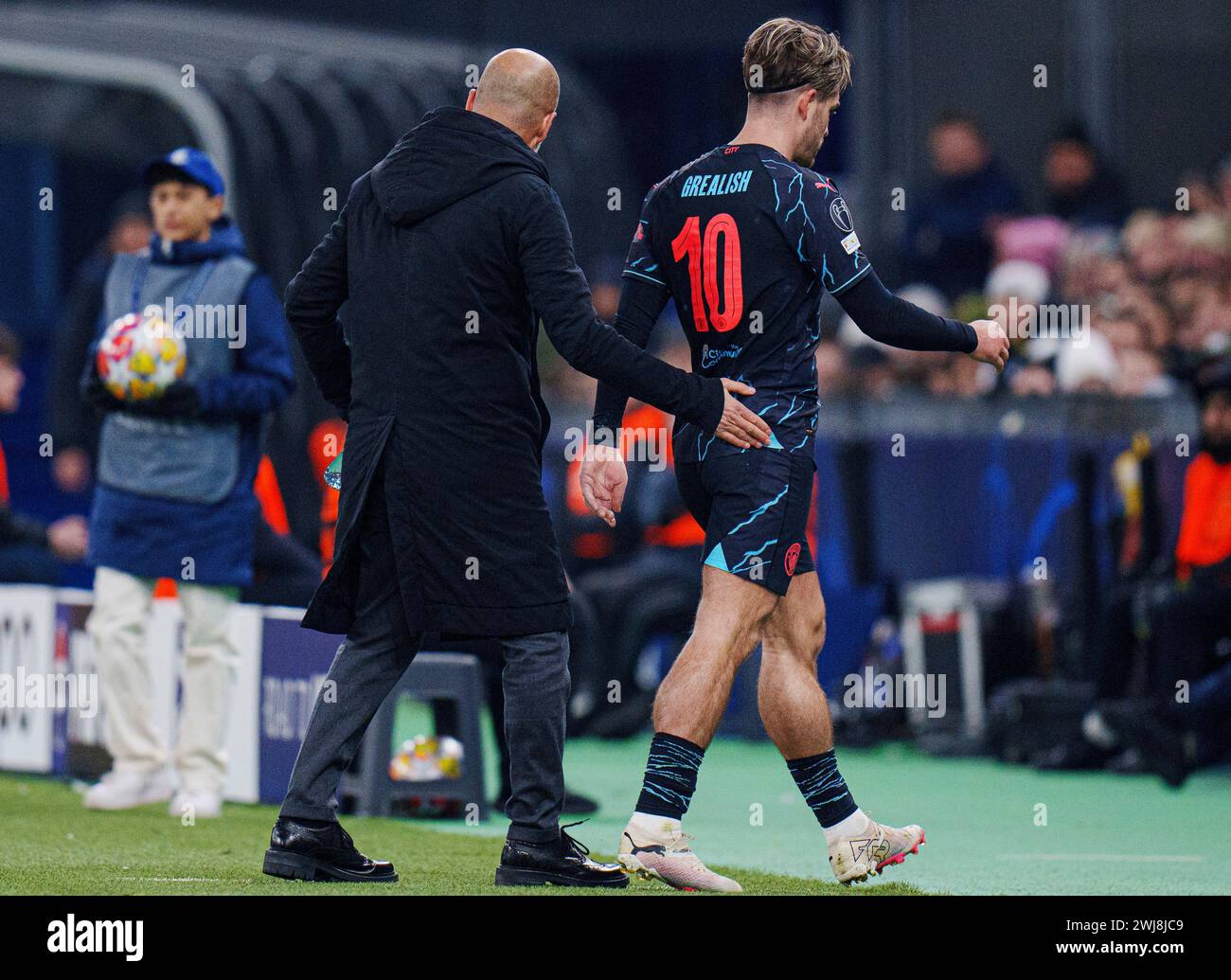 Manchester City's Jack Grealish is substituted and given a pat by Head ...