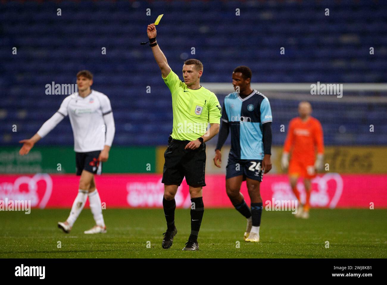 Referee Will Finnie shows yellow a card to Sam Vokes #9 of Wycombe ...