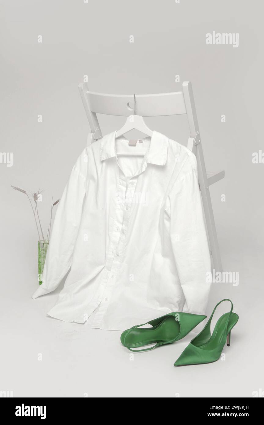 Clothes on a chair. Product photography, fashion still life. Spring ...