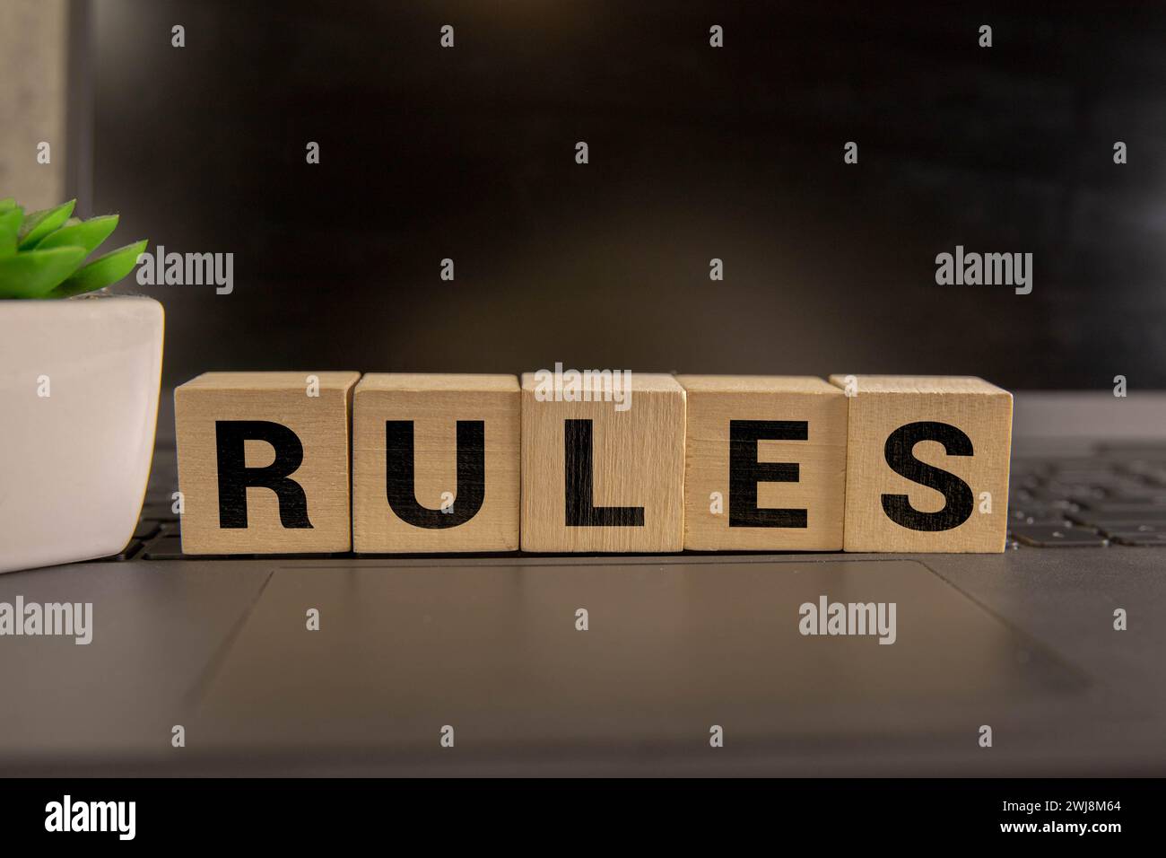 Hand arrange wood letters as Rules word Stock Photo - Alamy