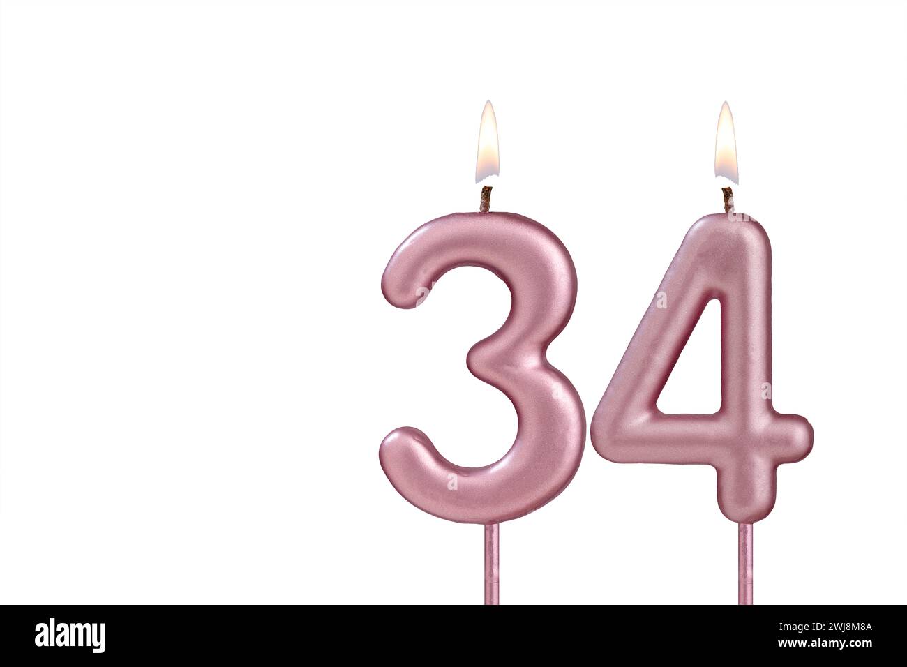 Lit birthday candle - Candle number 34 on white background Stock Photo ...