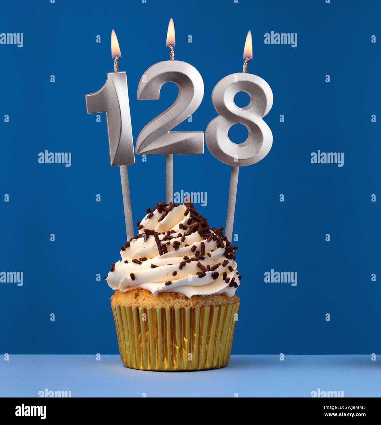 Vertical birthday card with cupcake - Lit candle number 128 on blue ...