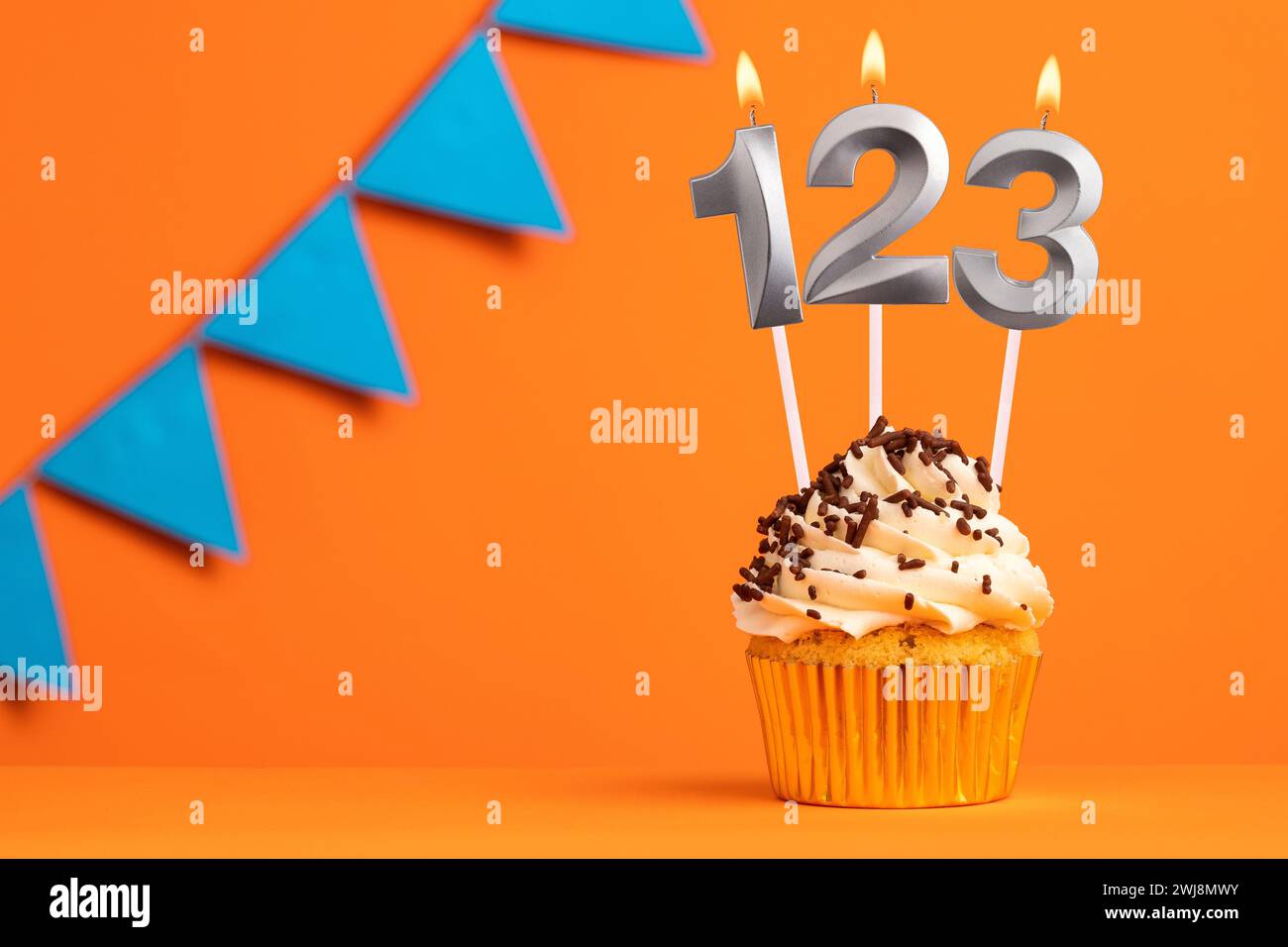 Candle number 123 - Cupcake birthday in orange background Stock Photo ...