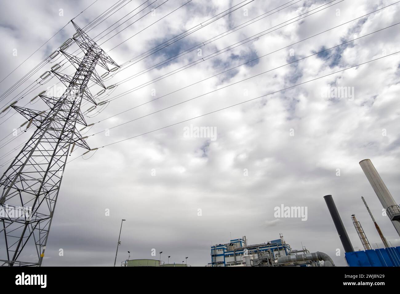 electric grid pylon seen from below, electricity grid pole in a cloudy ...