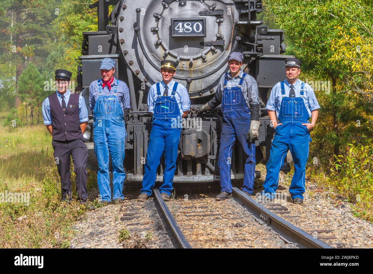 Train crew and volunteers pose in front of 1925 2-8-2 Mikado type ...