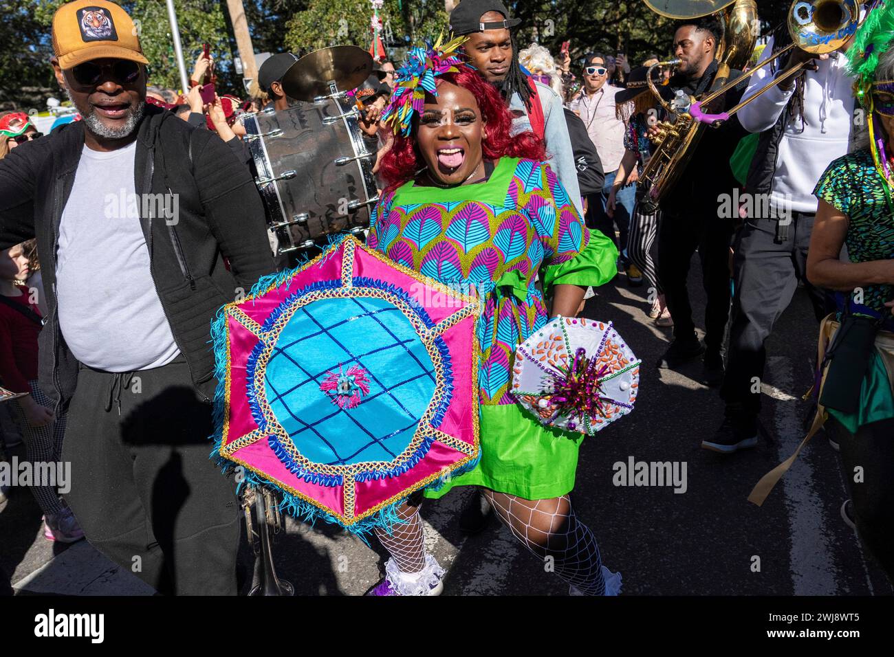Paradegoers are seen during the Krewe of Red Beans Mardi Gras Parade in ...