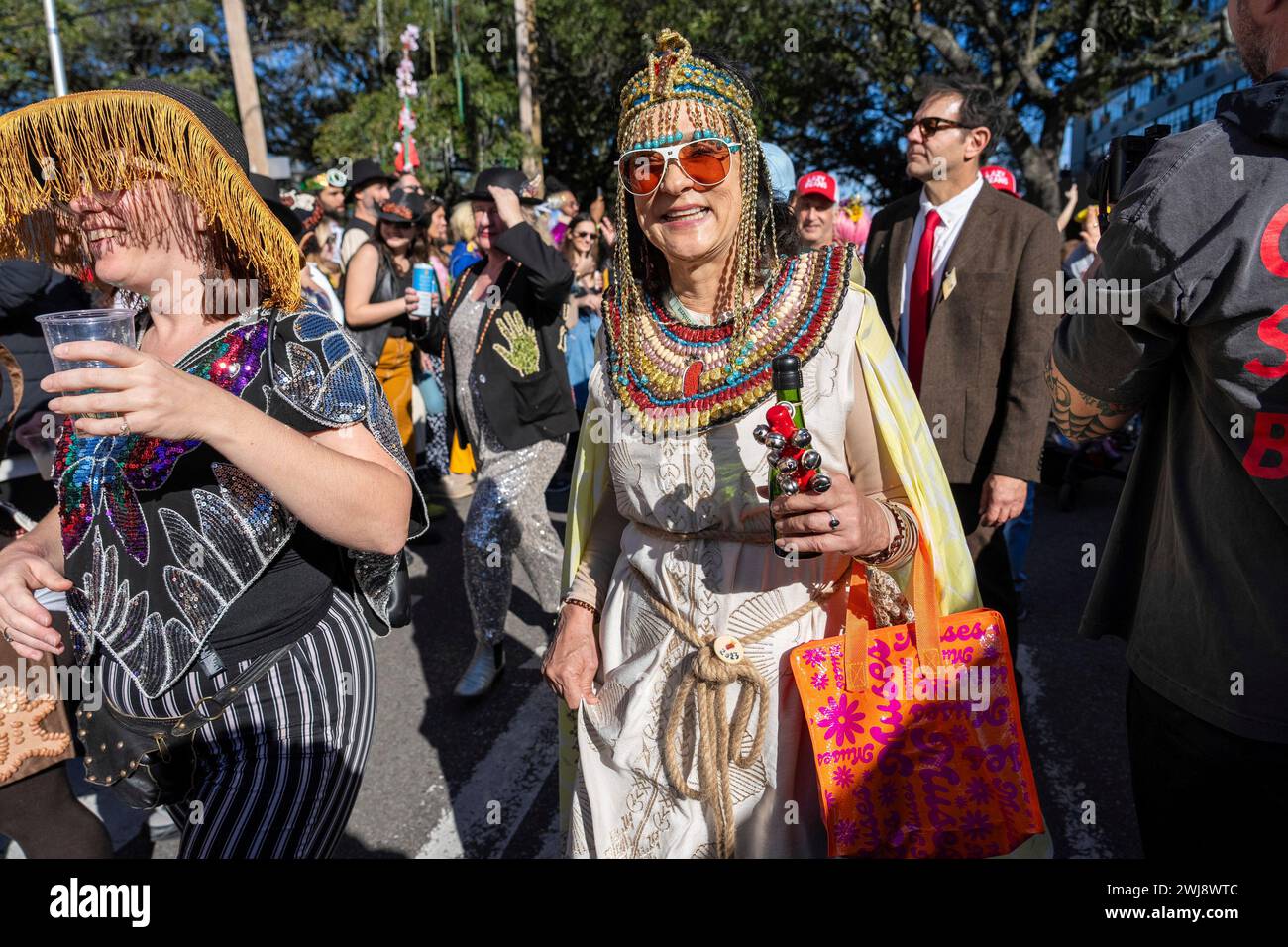 Paradegoers are seen during the Krewe of Red Beans Mardi Gras Parade in ...