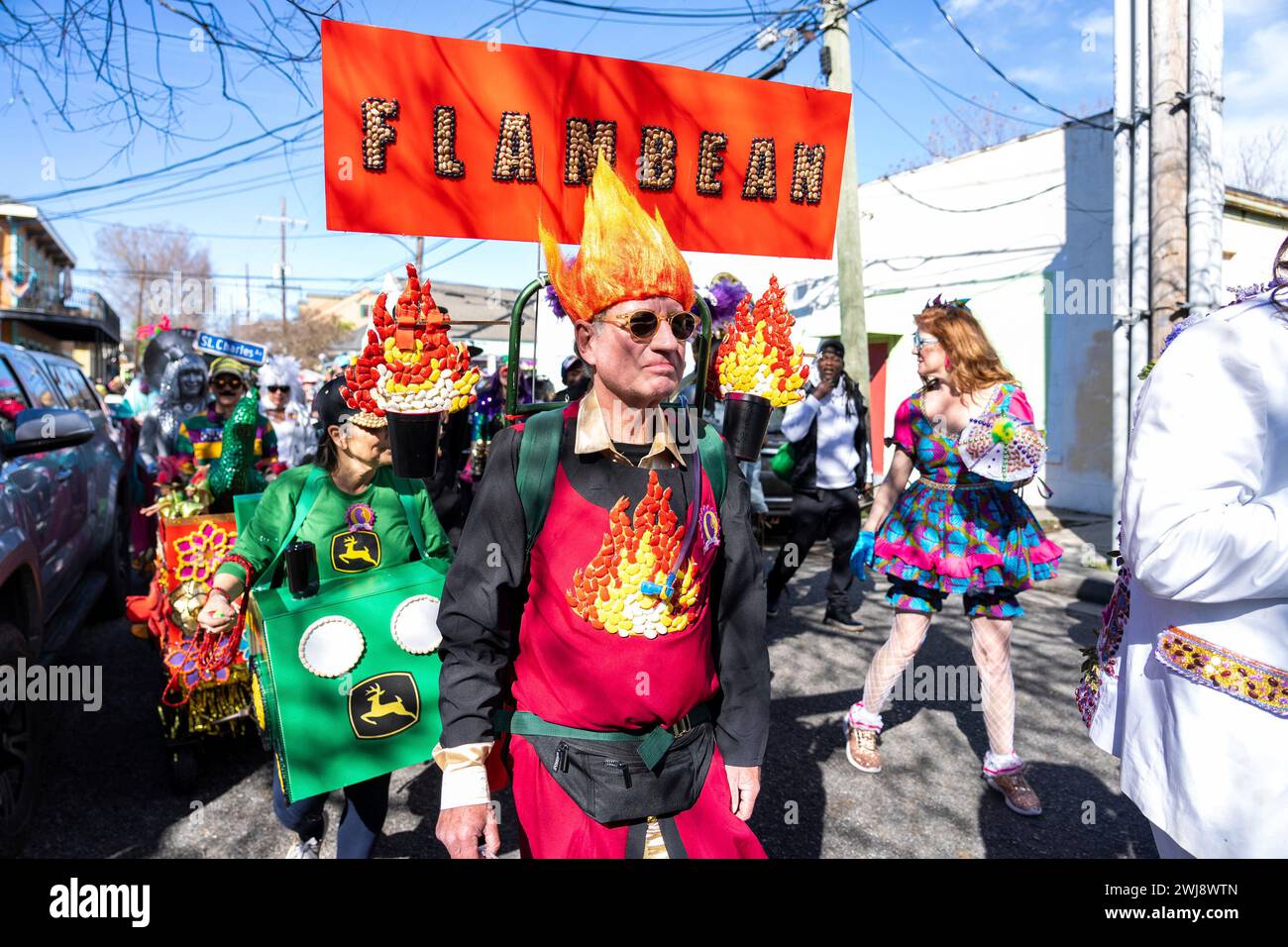 Paradegoers are seen during the Krewe of Red Beans Mardi Gras Parade in ...