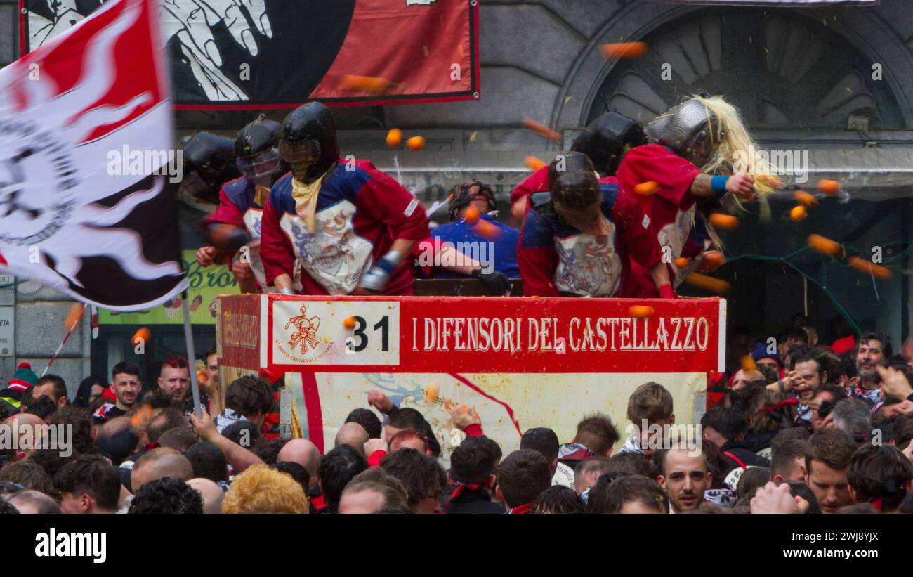 Ivrea, Italy. 12th Feb, 2024. Orange throwers fighting during the ...