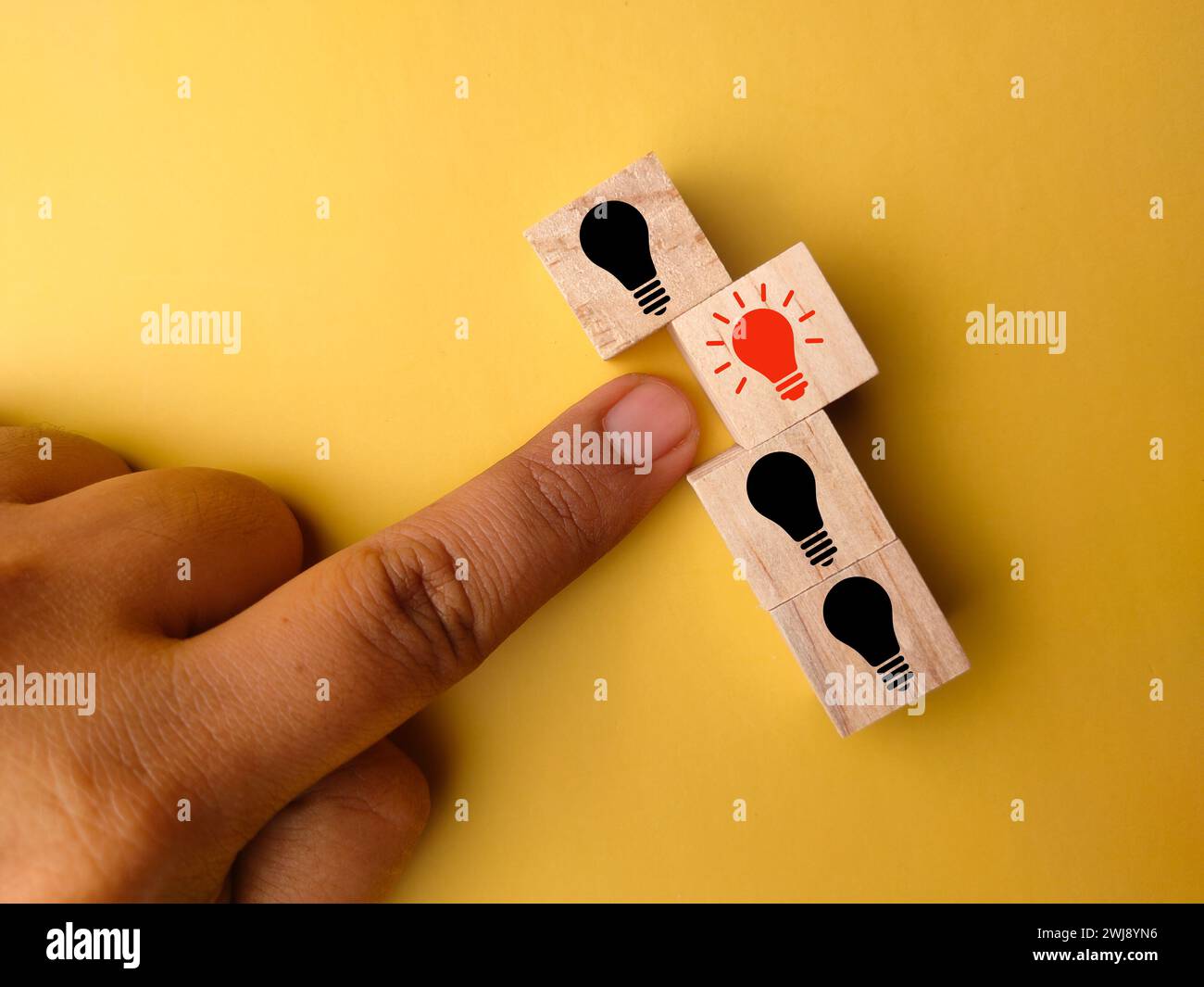 Wooden cube with a bulb icon and a light bulb is selected. the concept ...