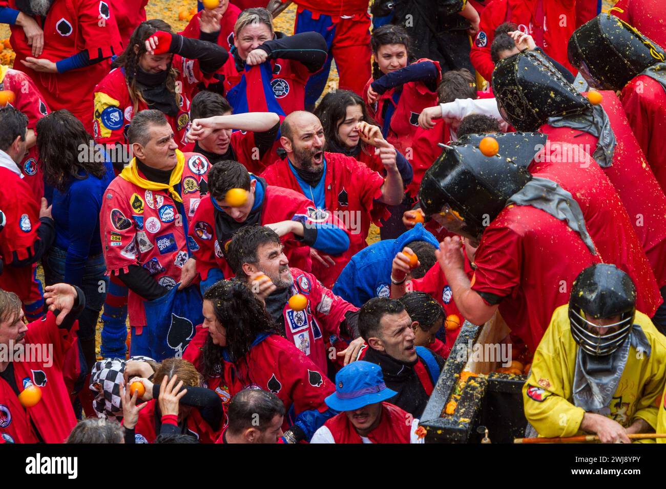 Ivrea, Italy. 12th Feb, 2024. Orange throwers fighting during the ...