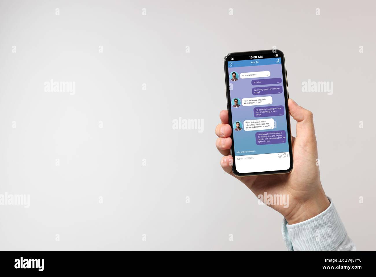 Man texting with friend using messaging application on smartphone ...