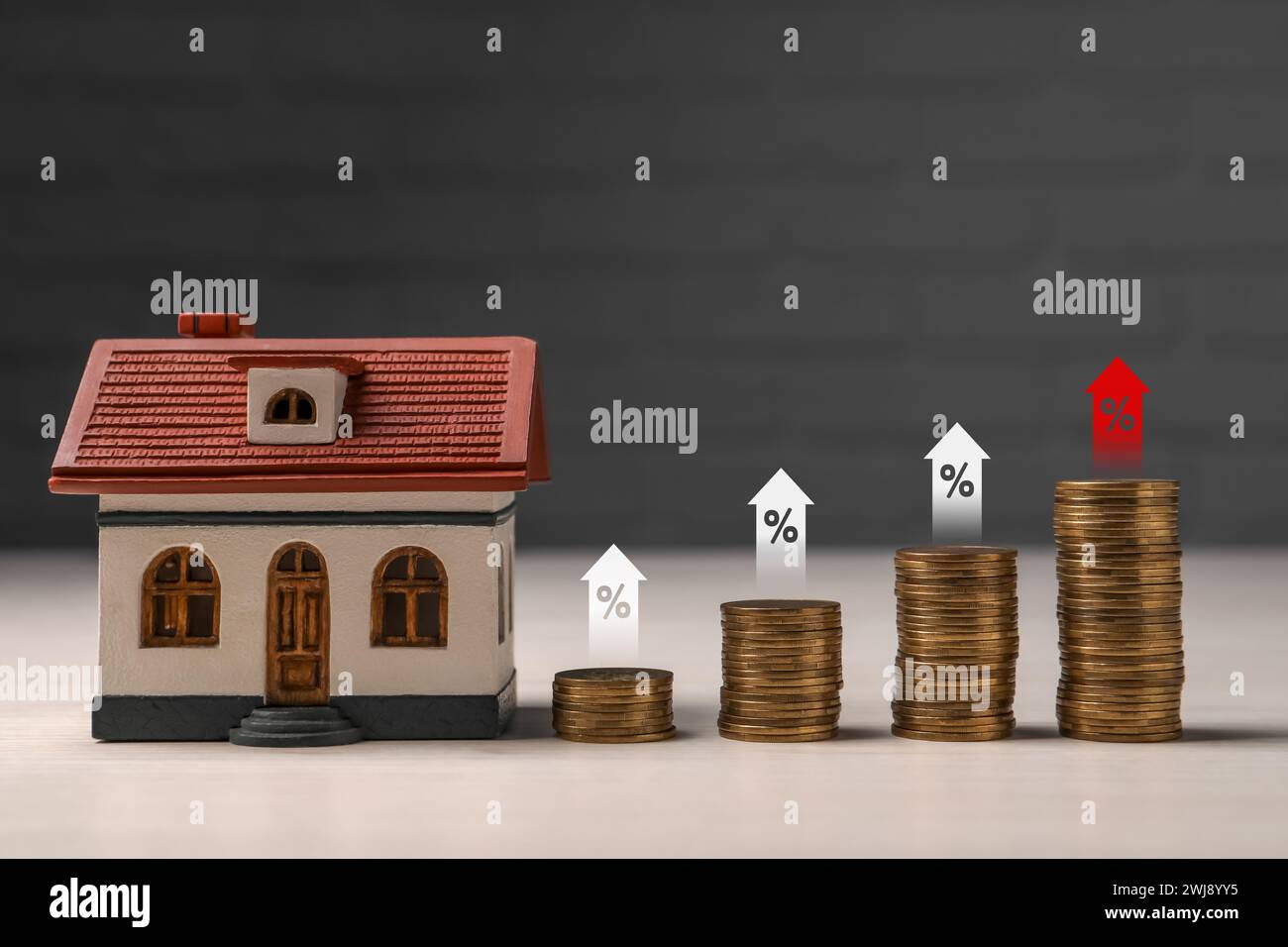 Mortgage rate. Model of house, stacked coins, arrows and percent signs ...