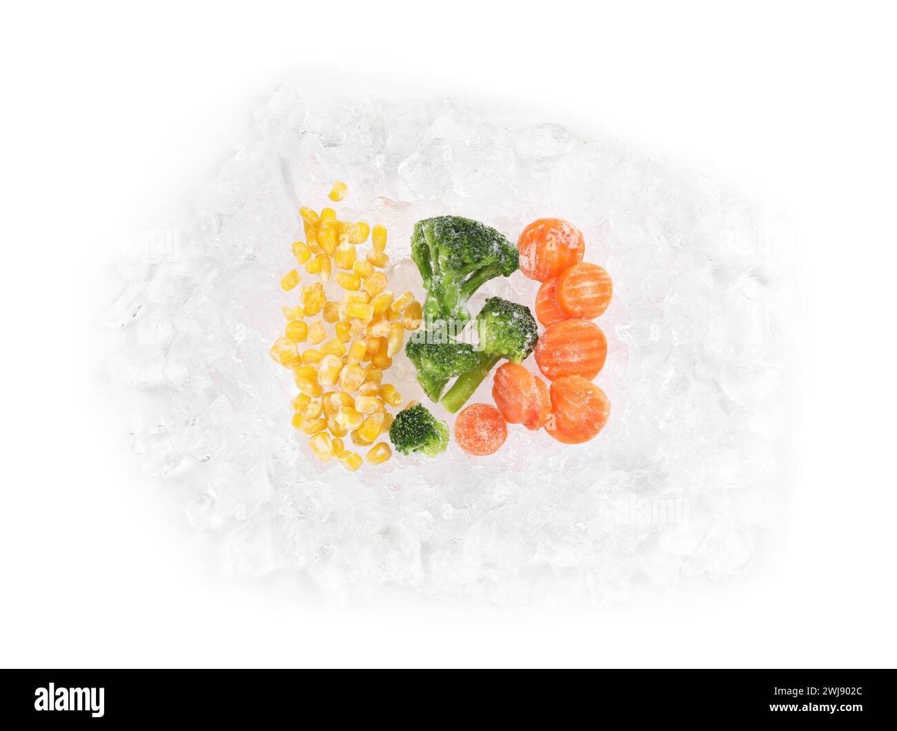 Mix of different frozen vegetables and ice isolated on white, top view ...