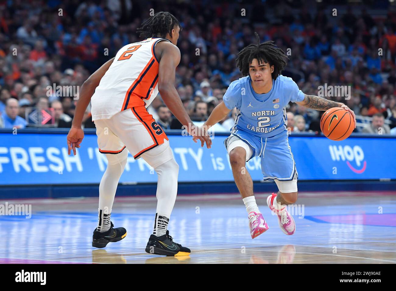 North Carolina guard Elliot Cadeau, right, is defended by Syracuse ... North Carolina guard Elliot Cadeau, right, is defended by Syracuse ...