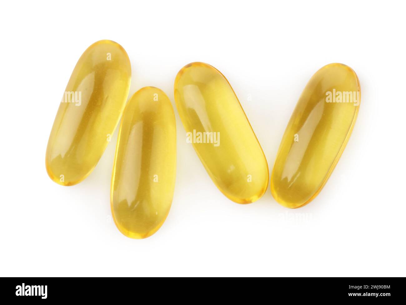 Many yellow vitamin capsules isolated on white, top view Stock Photo ...