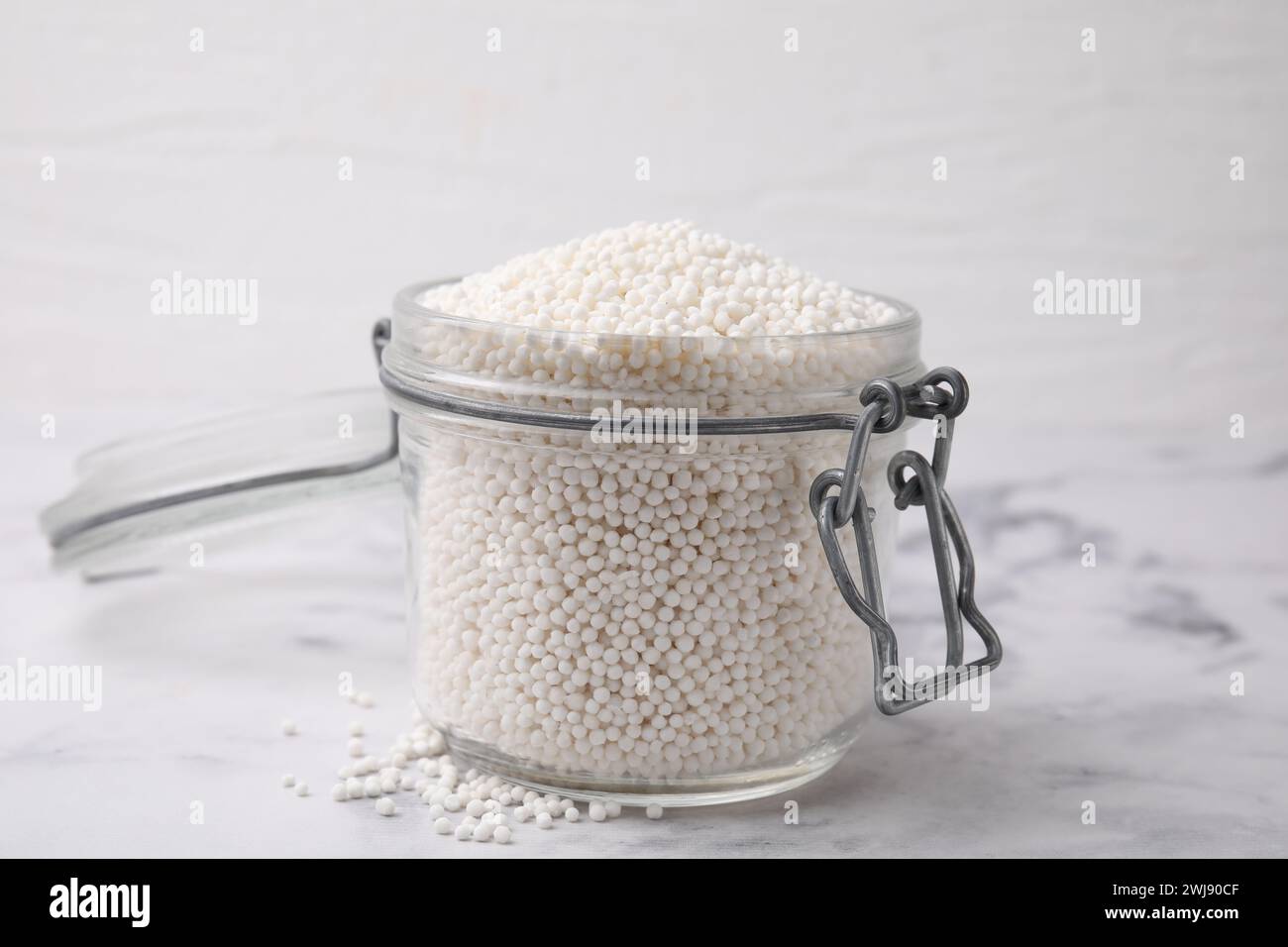 Tapioca pearls in jar on white marble table Stock Photo - Alamy