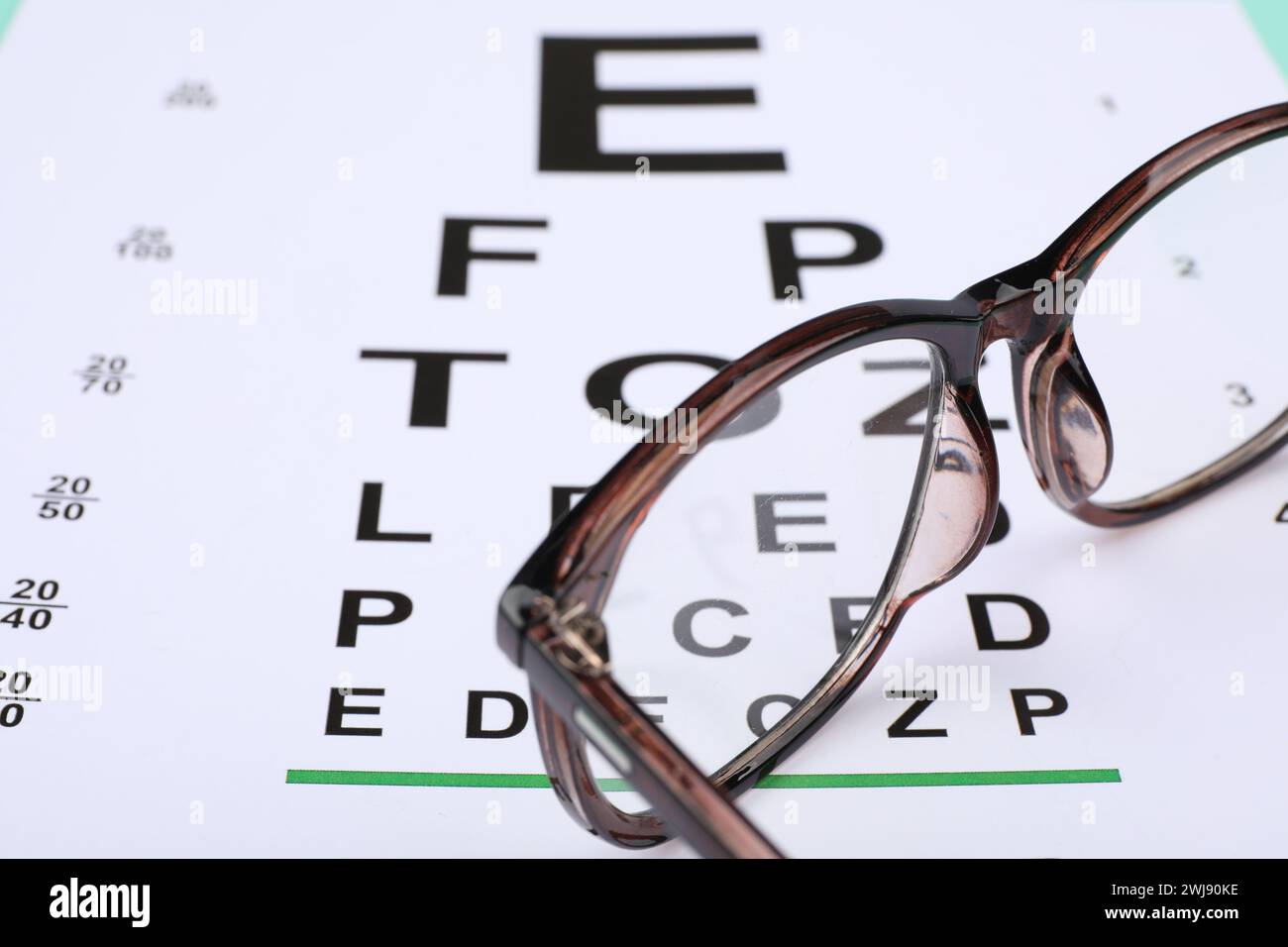 Vision test chart and glasses, closeup view Stock Photo - Alamy