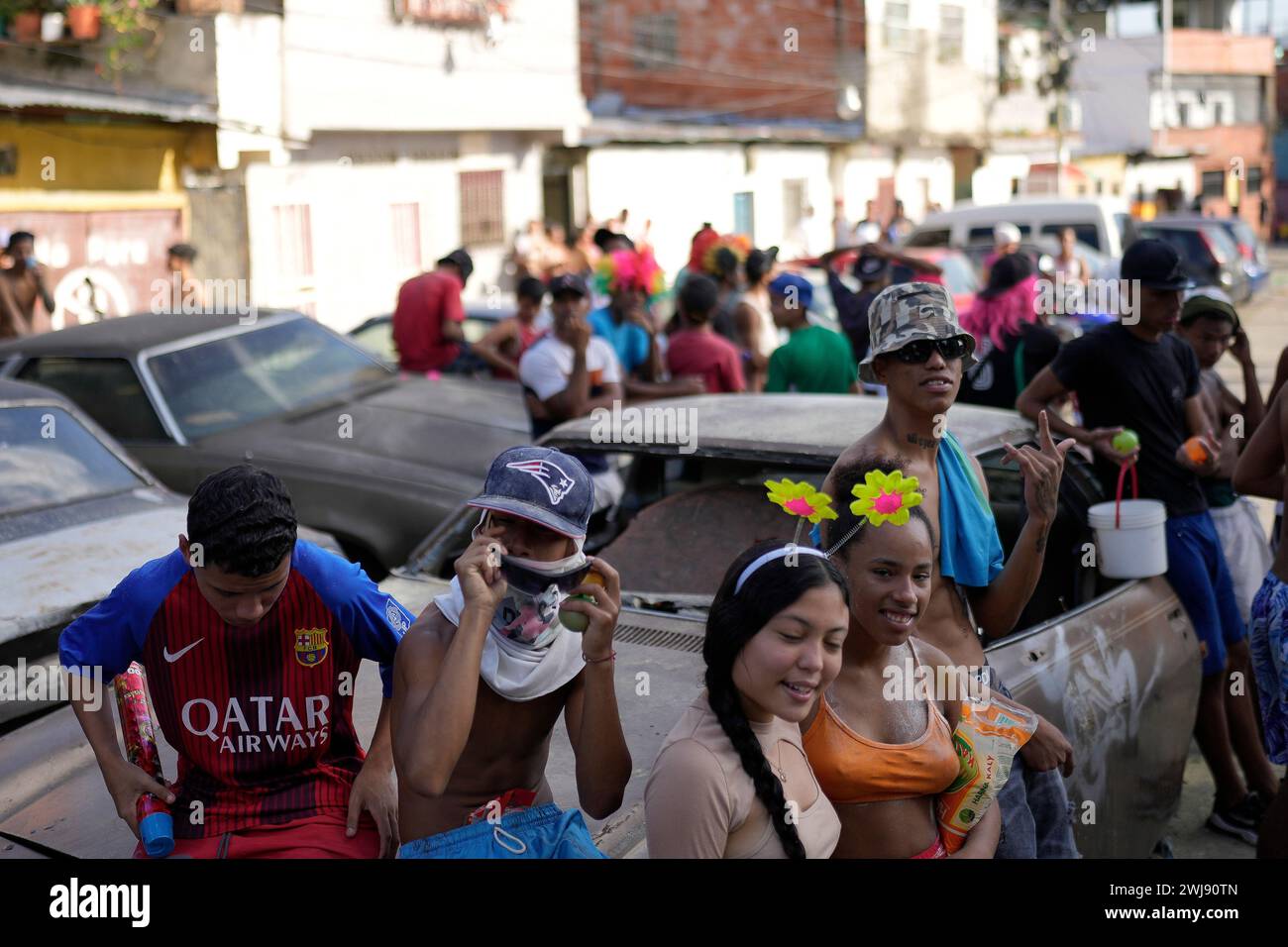 People gather during carnival celebrations in the Pinto Salinas ...