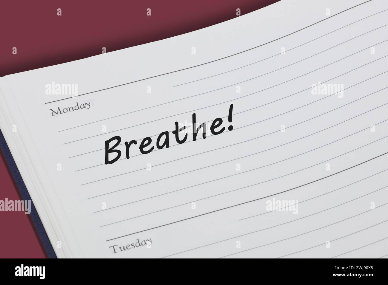 Breathe reminder message in an open diary Stock Photo - Alamy