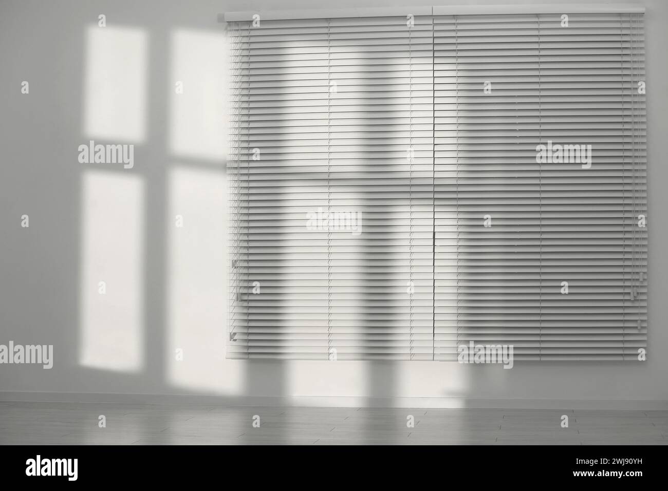 Light and shadows from window on wall indoors Stock Photo - Alamy