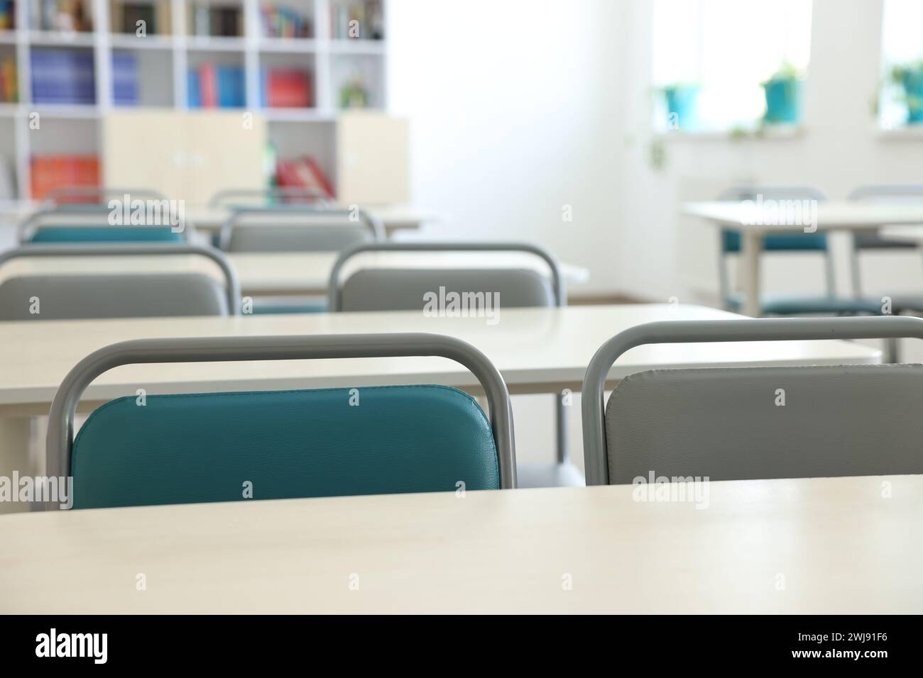 Empty school classroom with desks and chairs Stock Photo - Alamy