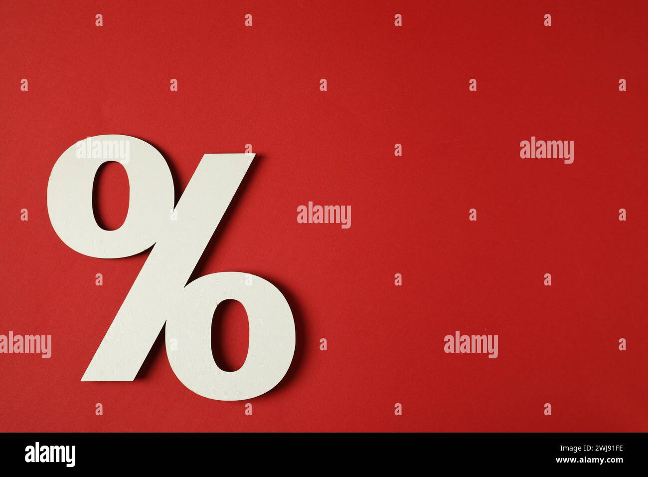 White percent sign on red background, top view. Space for text Stock ...