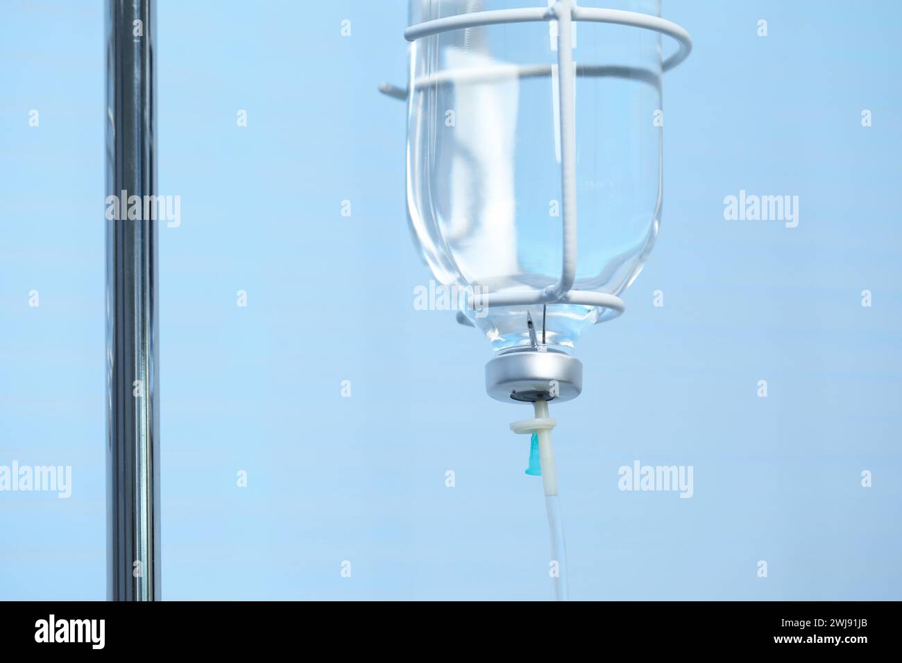 IV drip on light blue background, closeup Stock Photo - Alamy