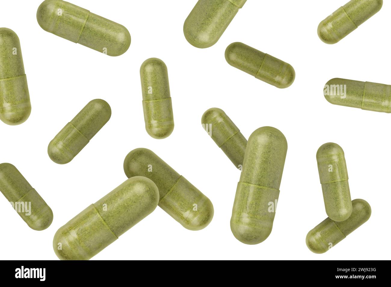 Vitamin. Many capsules falling on white background Stock Photo - Alamy