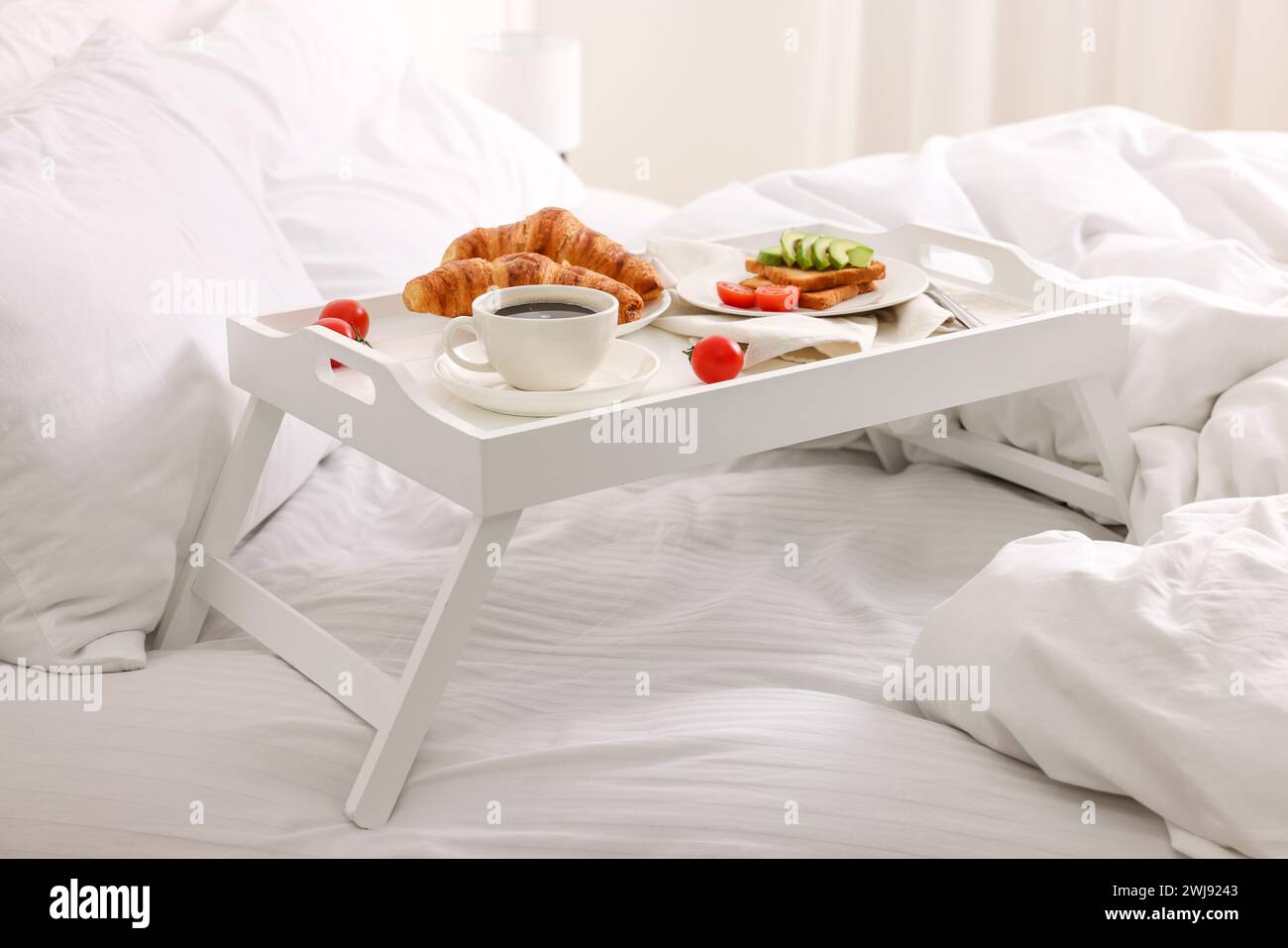 Good morning. Tray with tasty breakfast on bed at home Stock Photo - Alamy