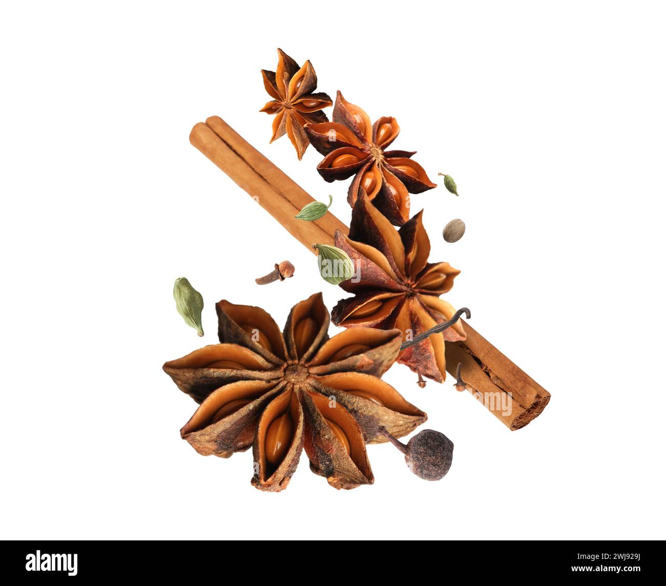 Different aromatic spices falling on white background Stock Photo - Alamy