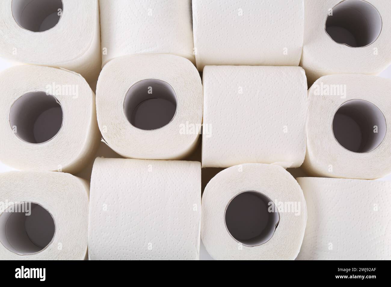 Many soft toilet paper rolls as background, above view Stock Photo - Alamy