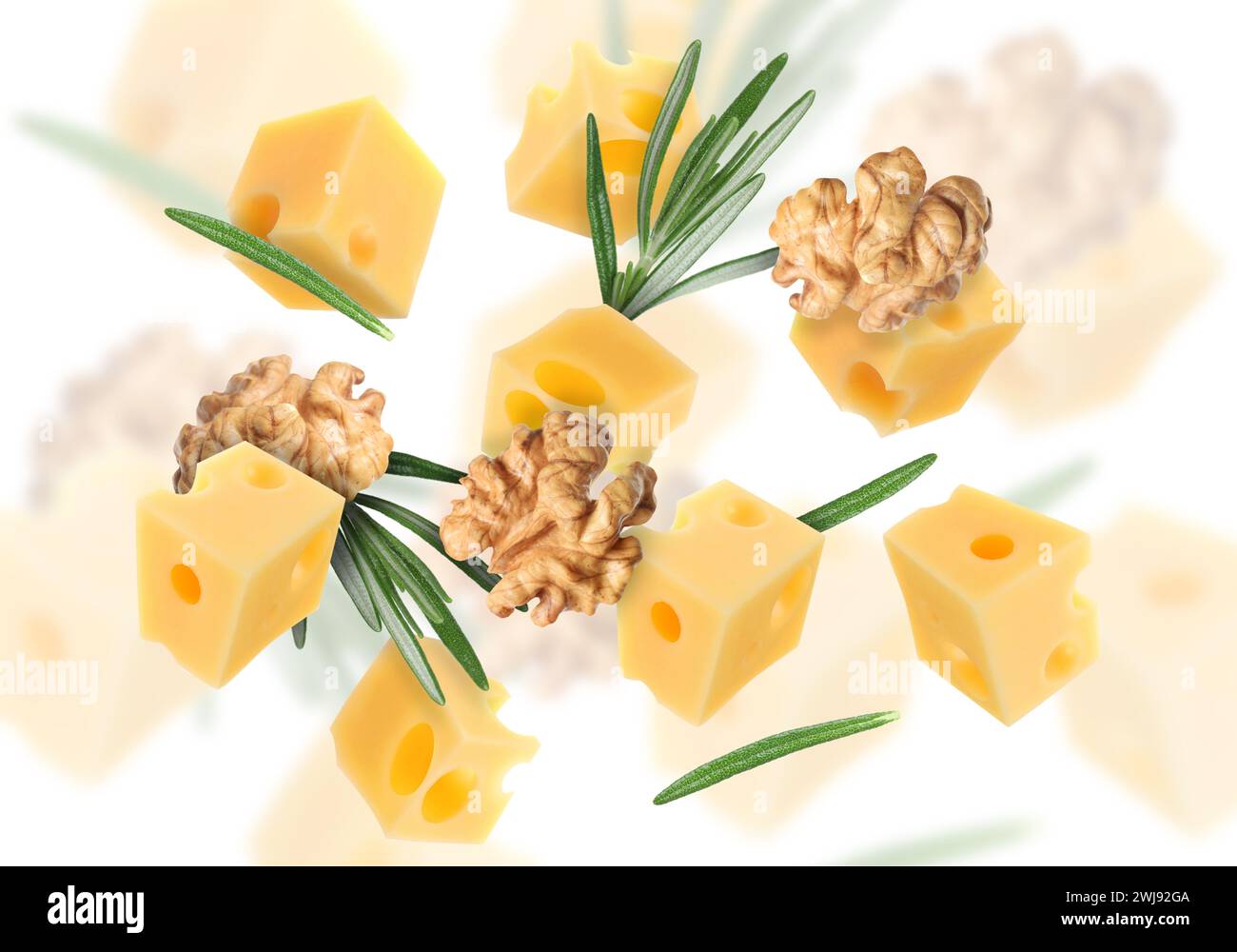Cheese, walnuts and rosemary flying on white background Stock Photo - Alamy