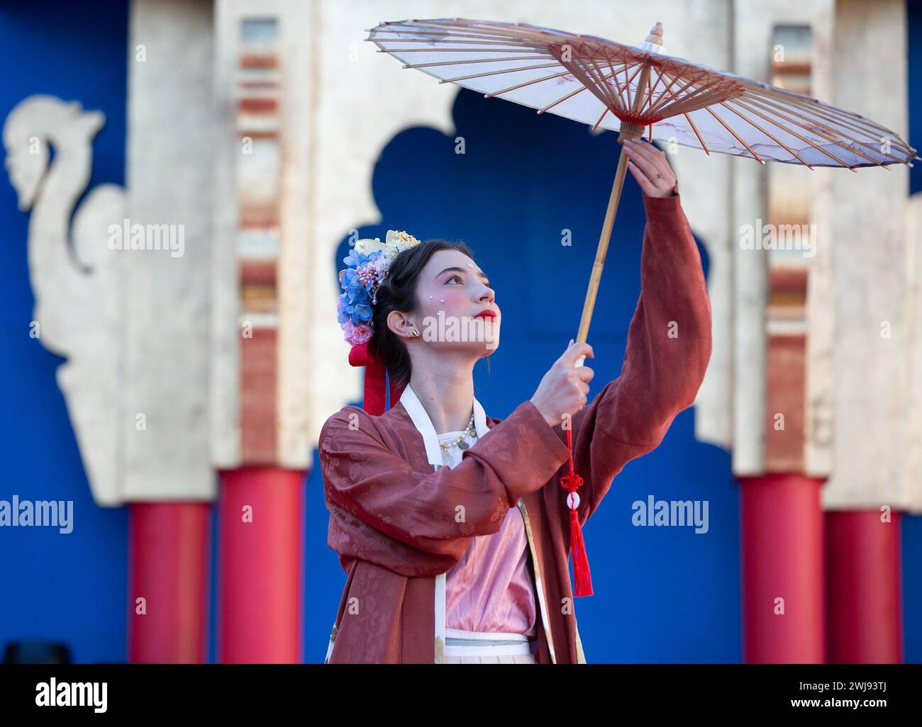 Venice, Italy. 13th Feb, 2024. An Italian volunteer displays Hanfu, a ...