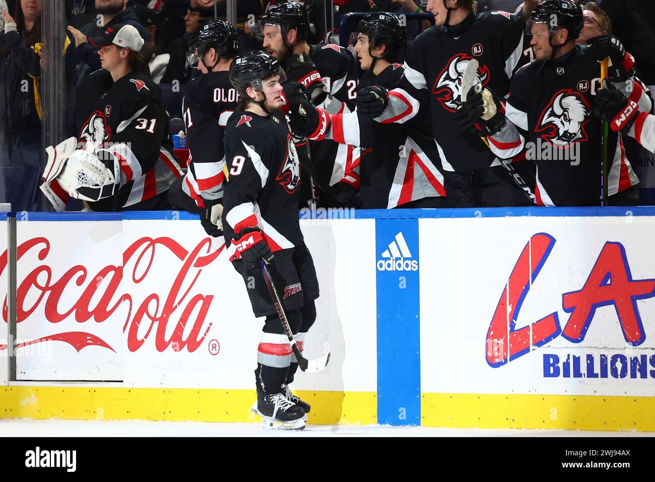 Buffalo Sabres left wing Zach Benson (9) is congratulated for his goal ...
