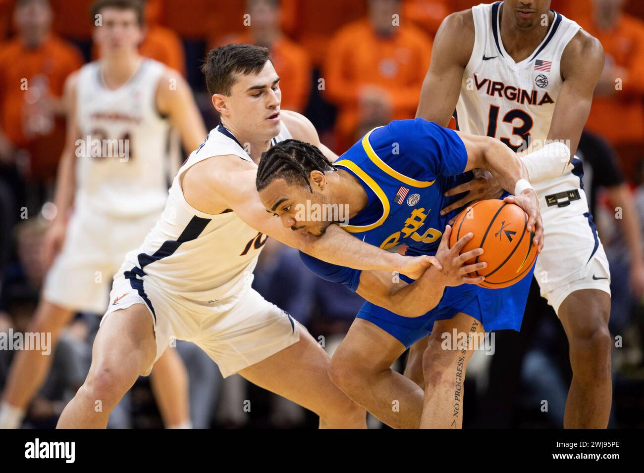 Virginia's Taine Murray and Ryan Dunn (13) tries to knock the ball away ...