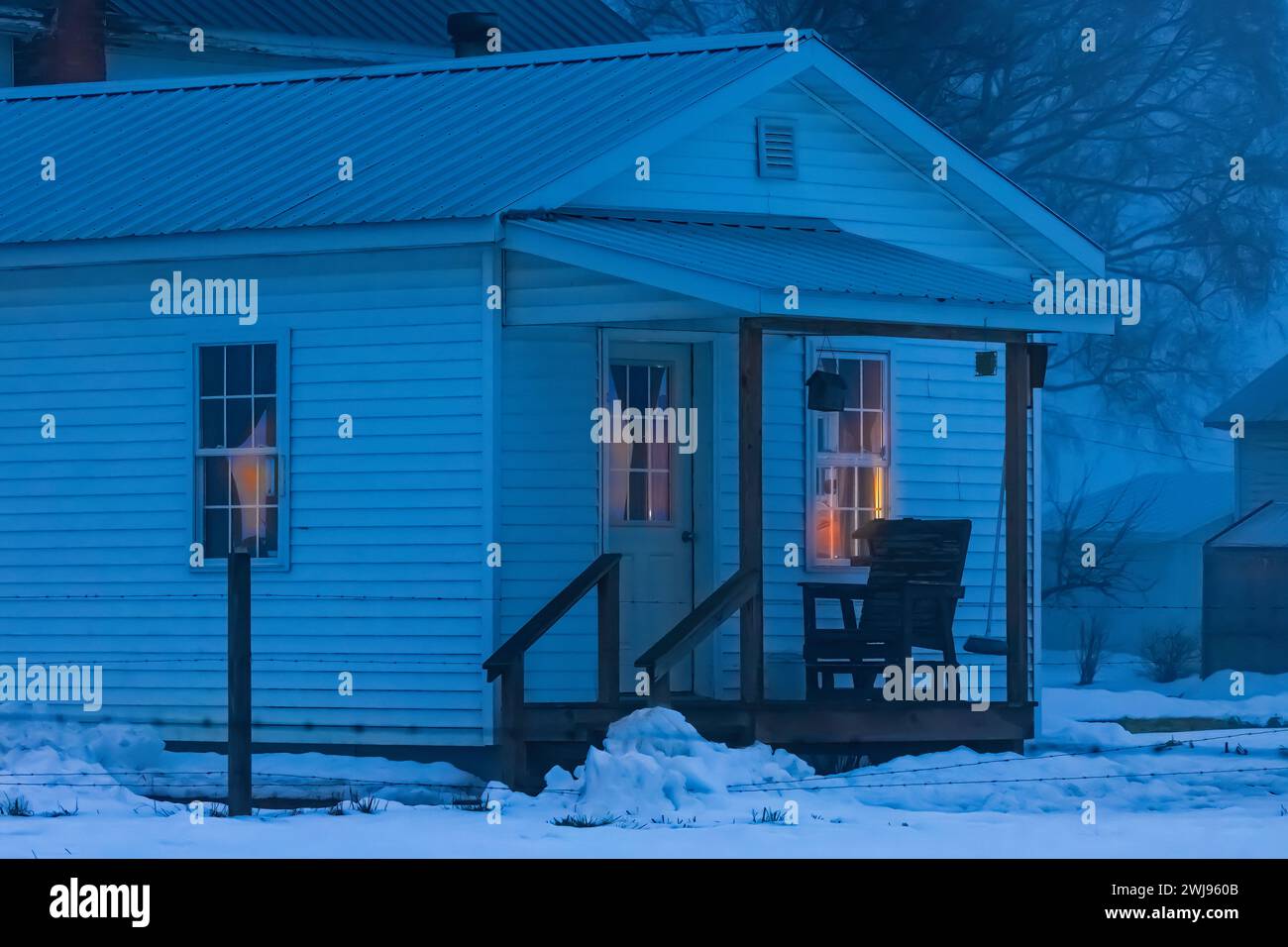 Amish house at twilight on a foggy day in Mecosta County, Michigan, USA ...