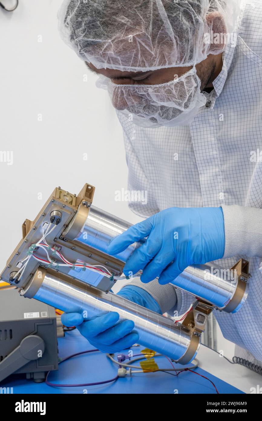 Lunar rover scientist examining hydrogen-seeking instrument Stock Photo ...