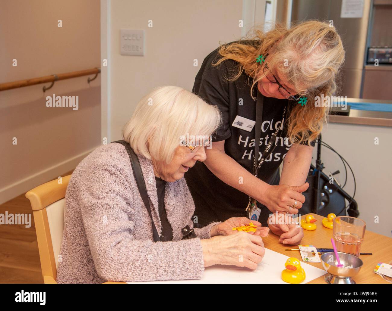 Care home resident taking part in activity Stock Photo - Alamy