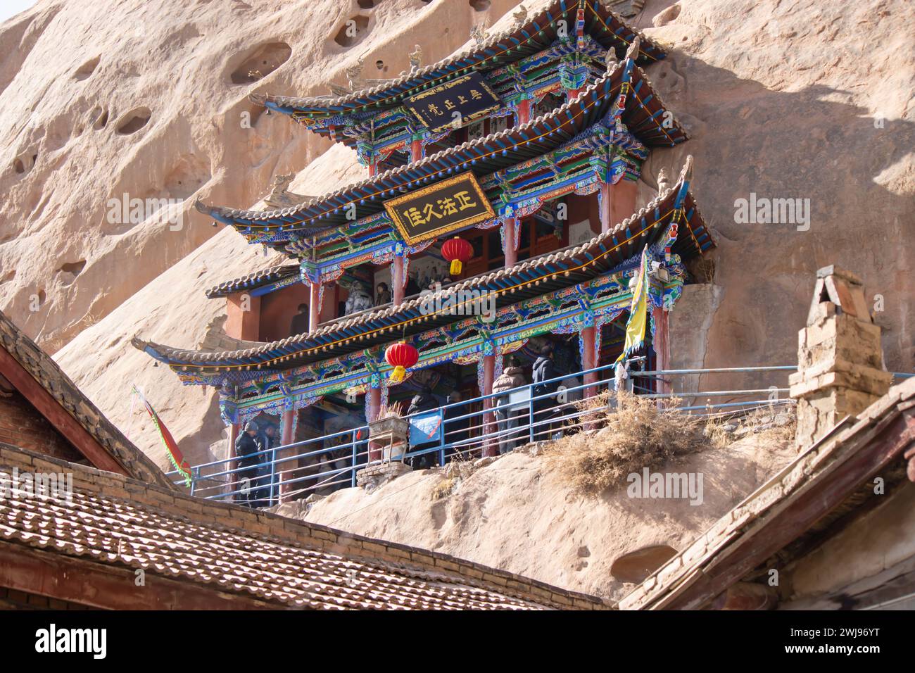 A view of a pavilion built on the cliff in the A-Thousand-Buddha-Caves ...