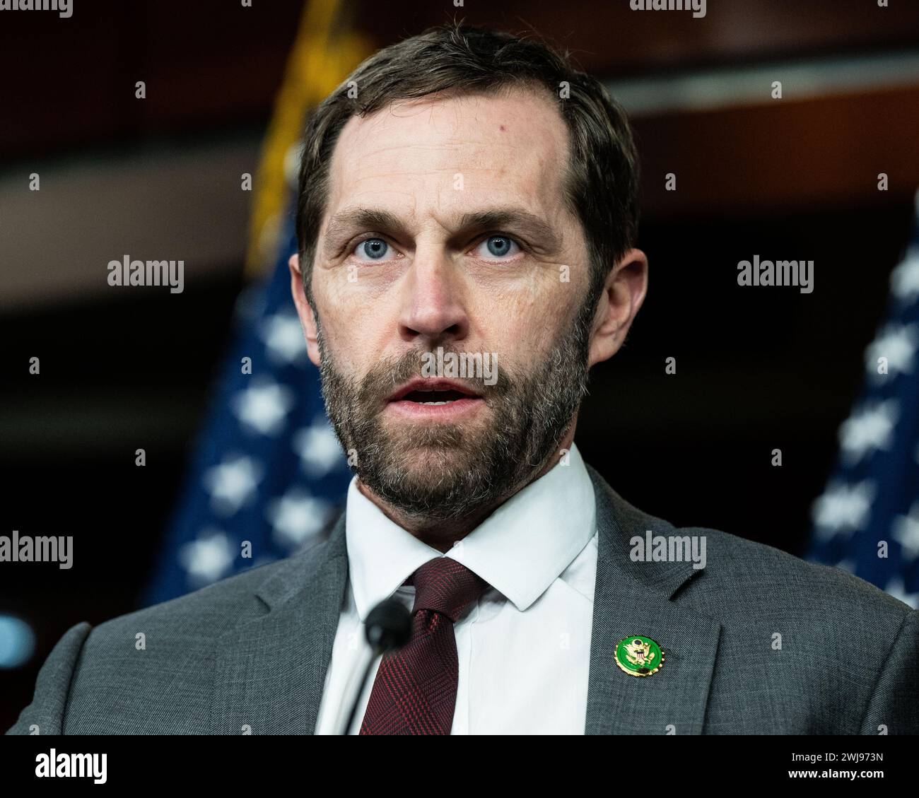 U.S. Representative Jason Crow (D-CO) speaking at a press conference ...